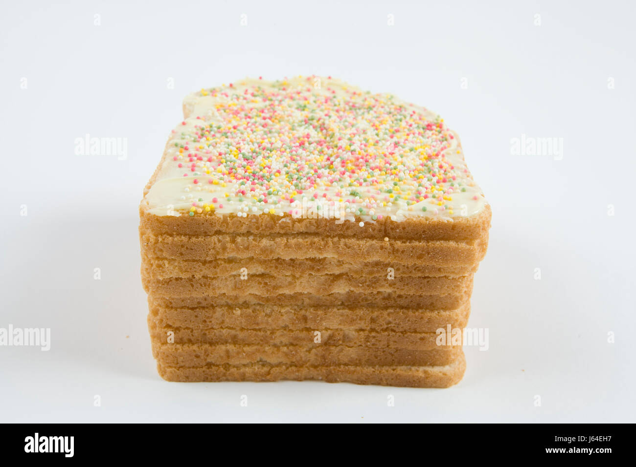 a quirky icing birthday bread covered with sprinkles on white ...