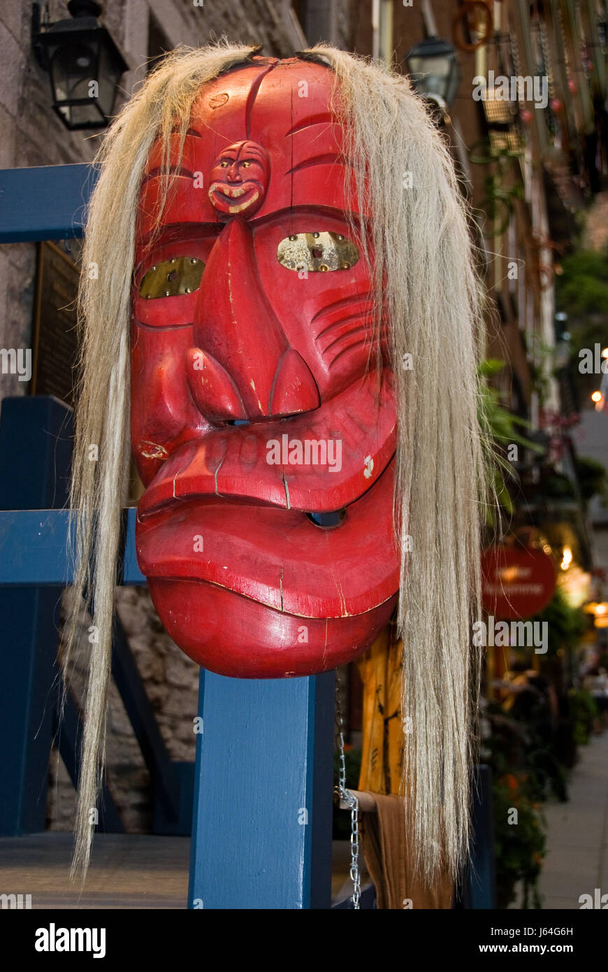 wood ghost long totem carved hair red mask mouth eye organ skew fear ...