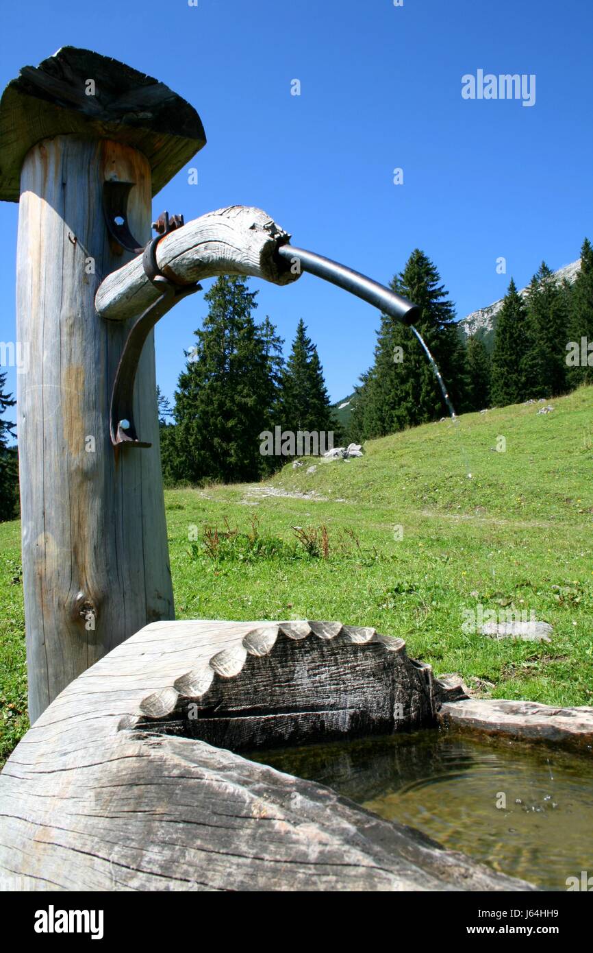wood fountain ray trough mountain water blue tree trees mountains green ...