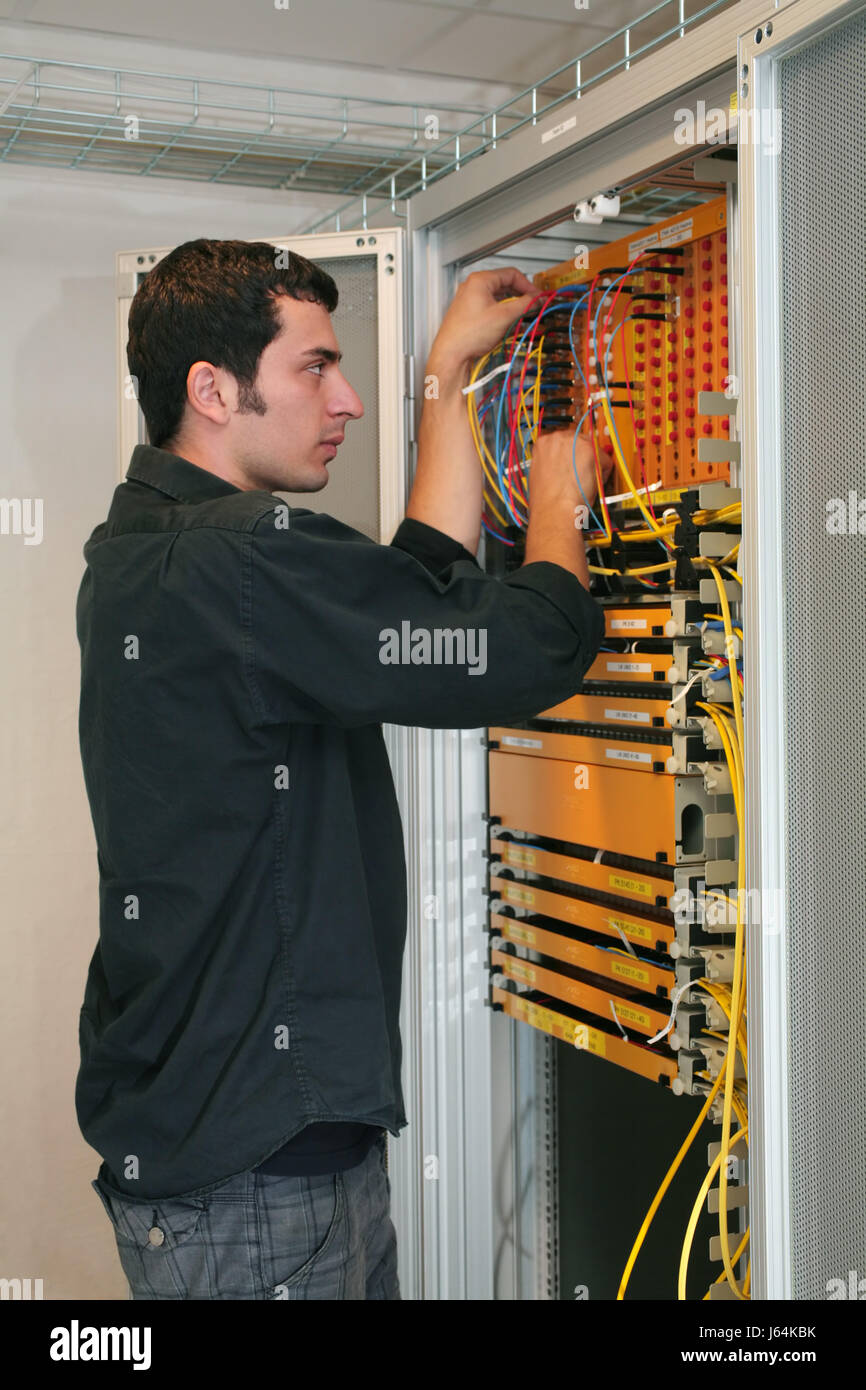 service technician in server room Stock Photo - Alamy