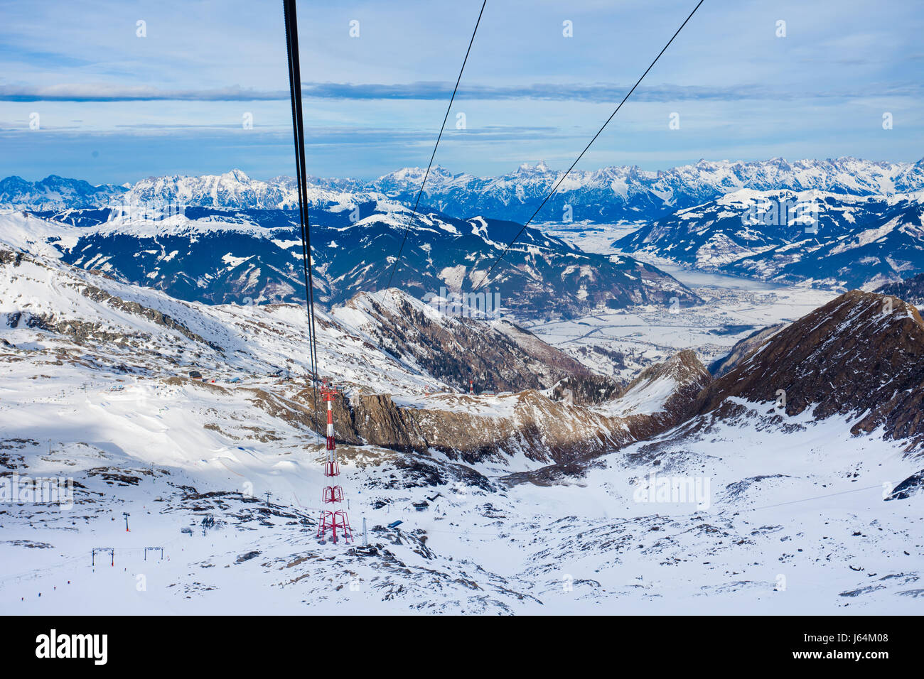winter with ski slopes of kaprun resort next to kitzsteinhorn peak in ...