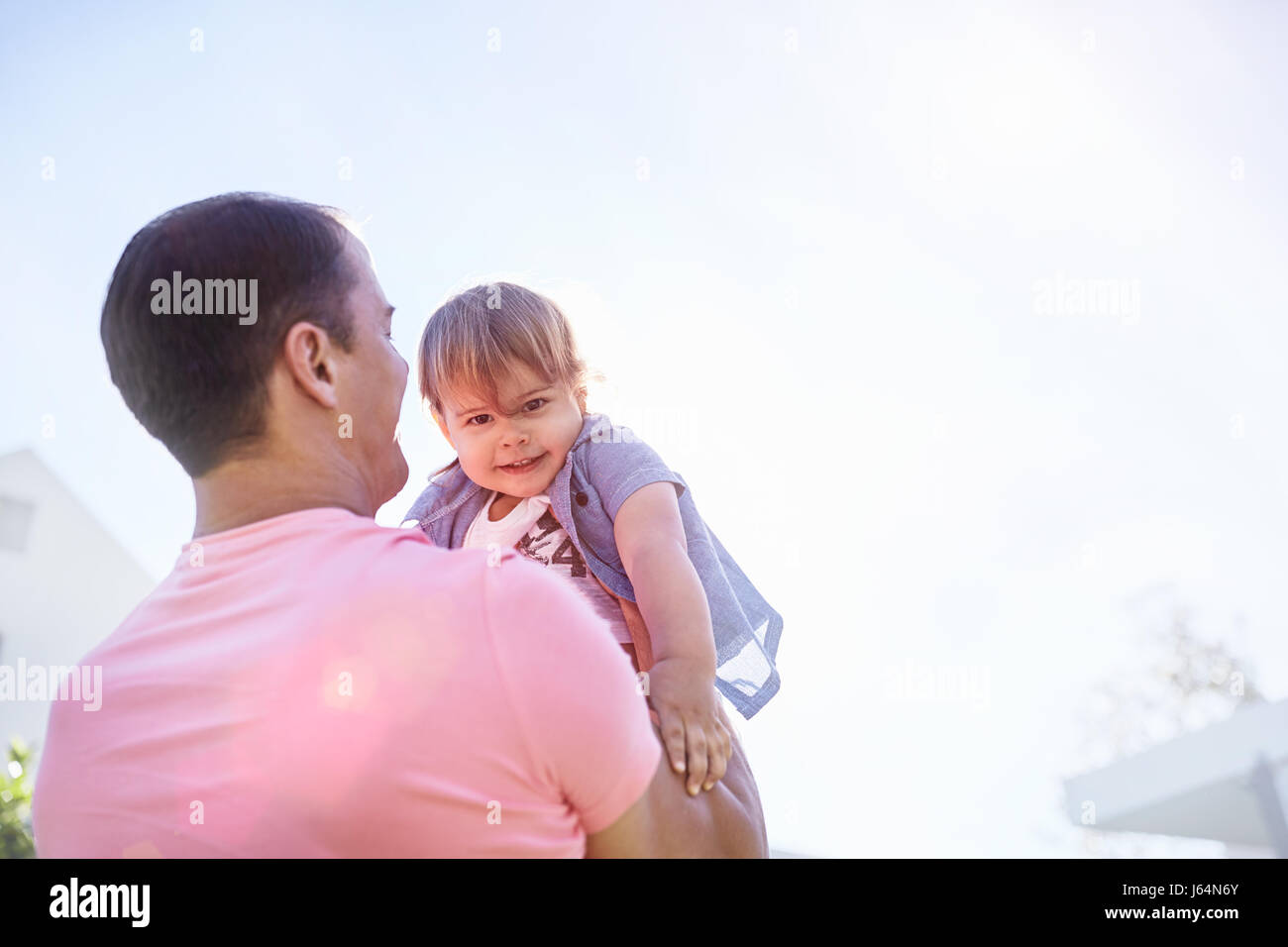 Father lifting baby son Stock Photo - Alamy
