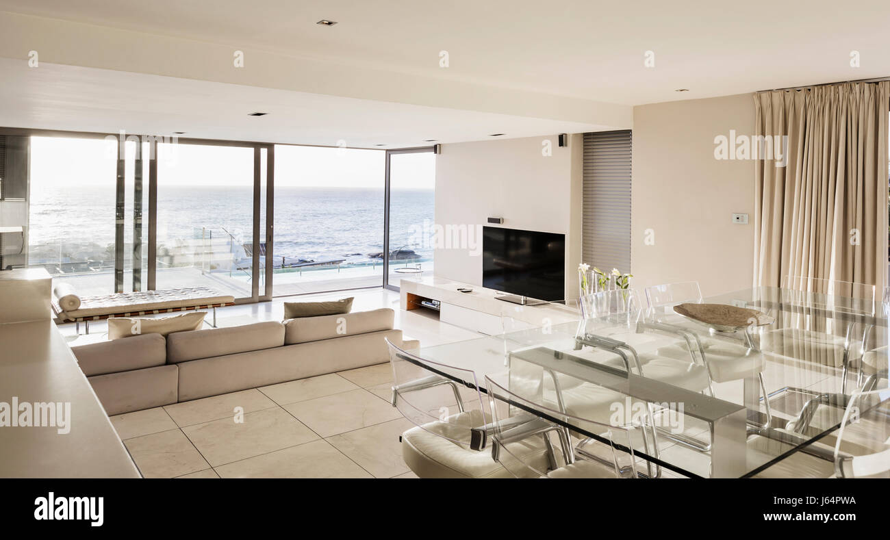 Modern white open floor plan with ocean view Stock Photo - Alamy