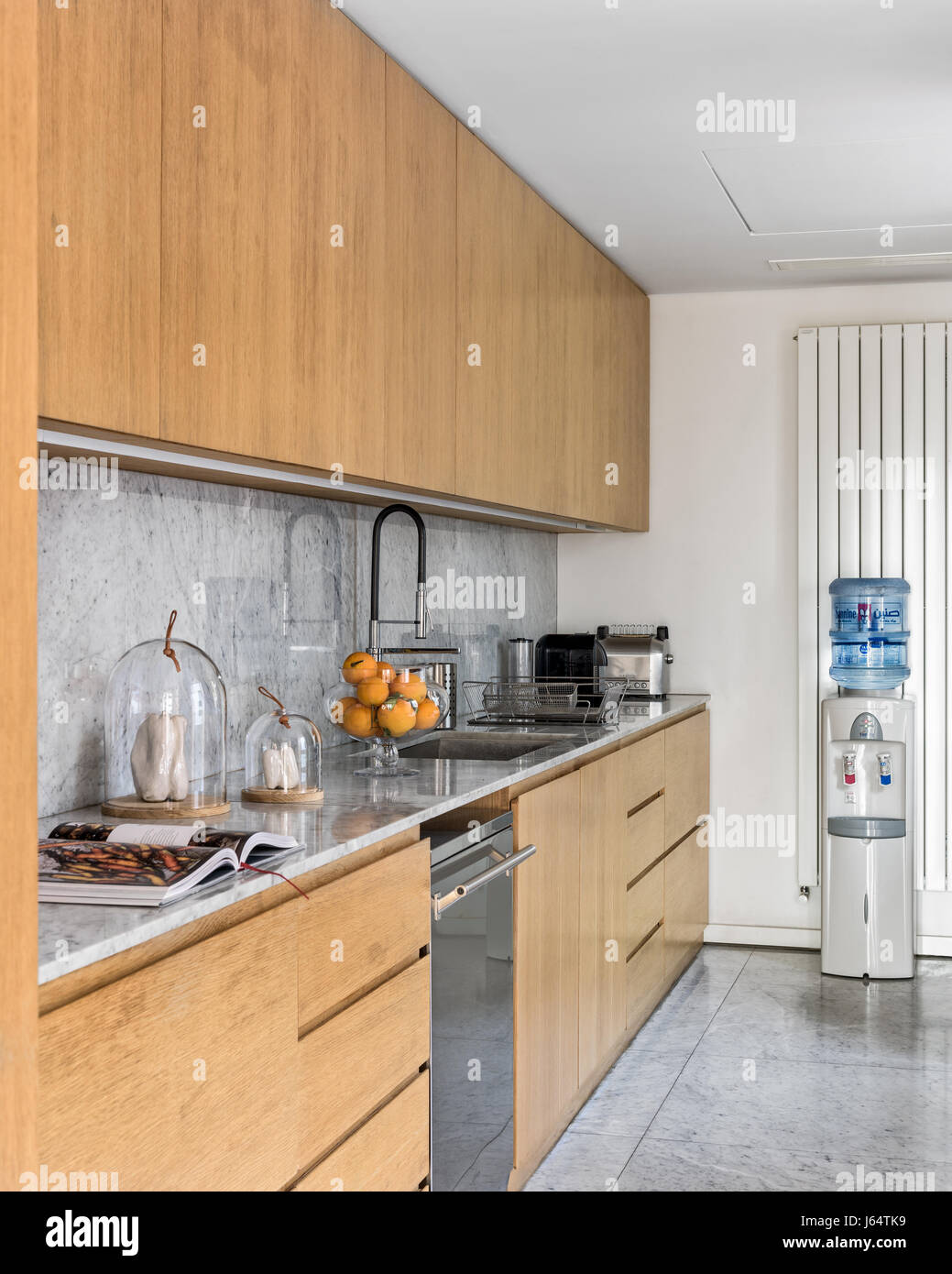Kitchen with oak finished units and marble work top and flooring Stock ...