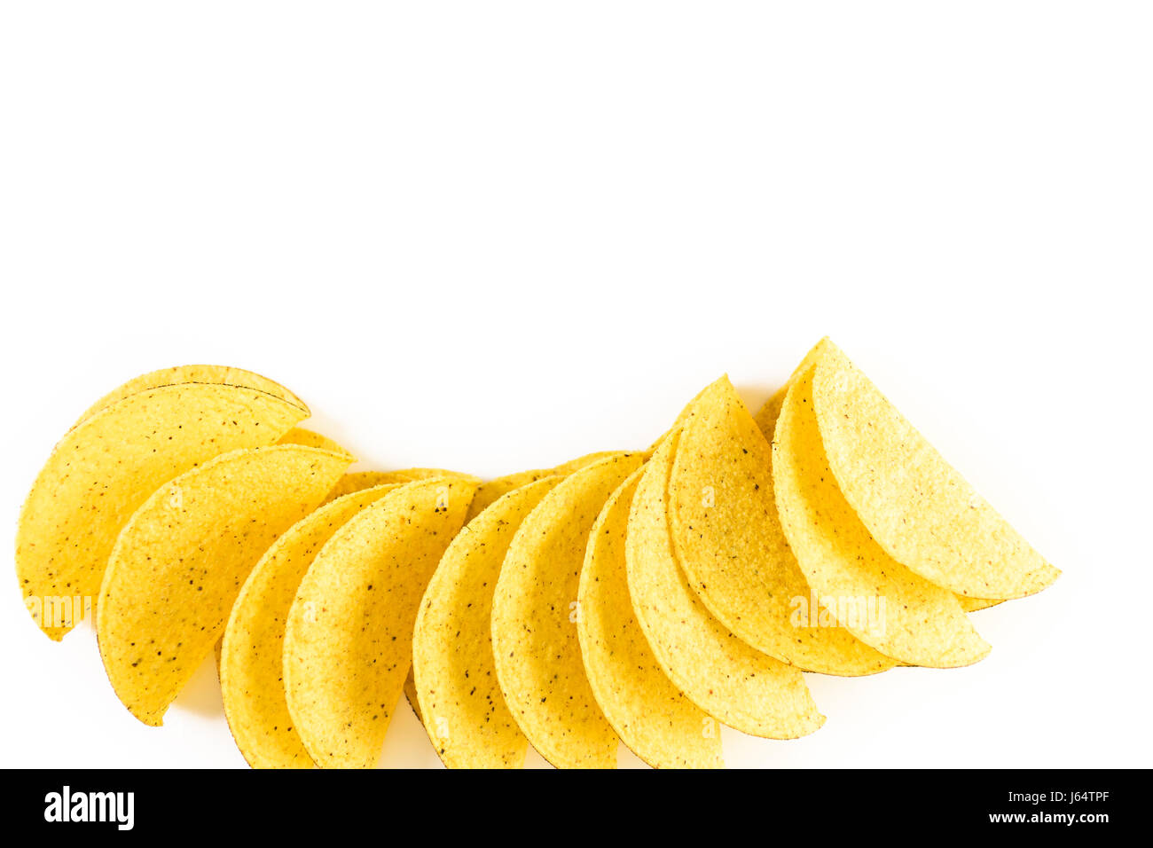 Yellow corn taco shells on a white background Stock Photo - Alamy