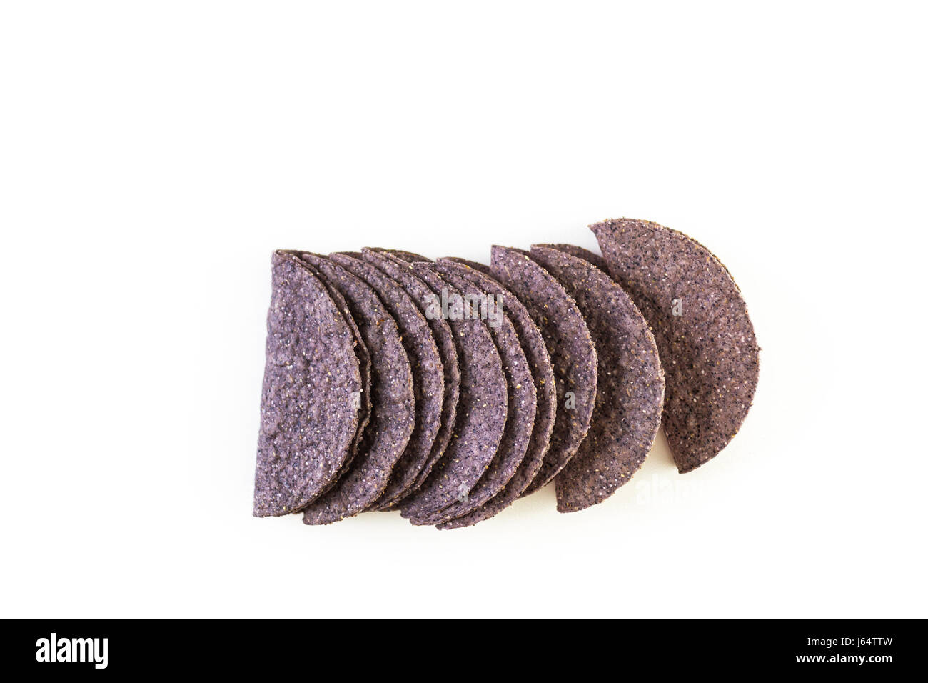 Blue corn taco shells on a white background Stock Photo - Alamy