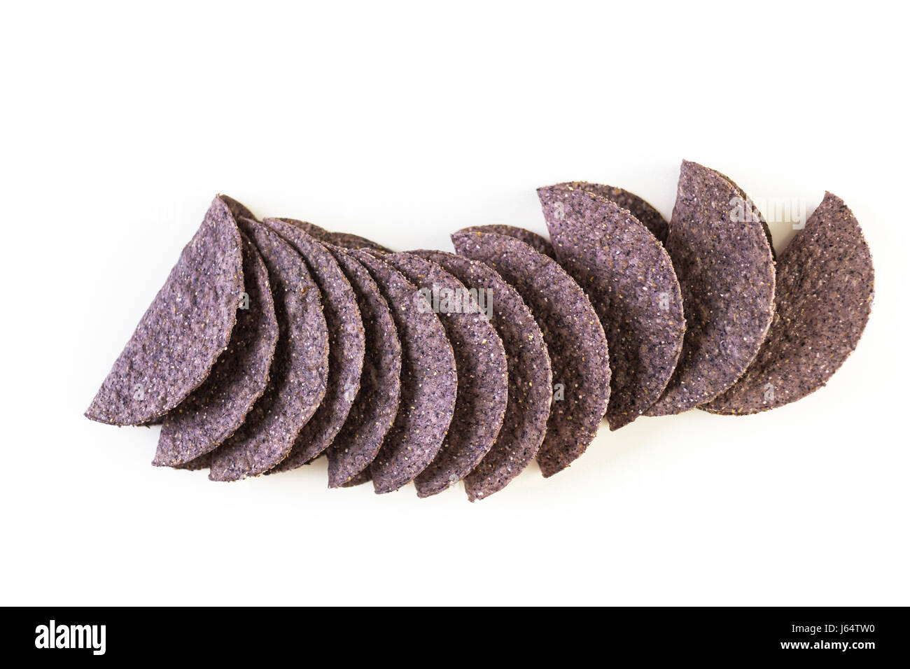 Blue corn taco shells on a white background Stock Photo - Alamy