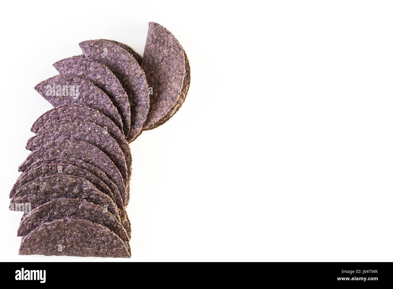 Blue corn taco shells on a white background Stock Photo - Alamy