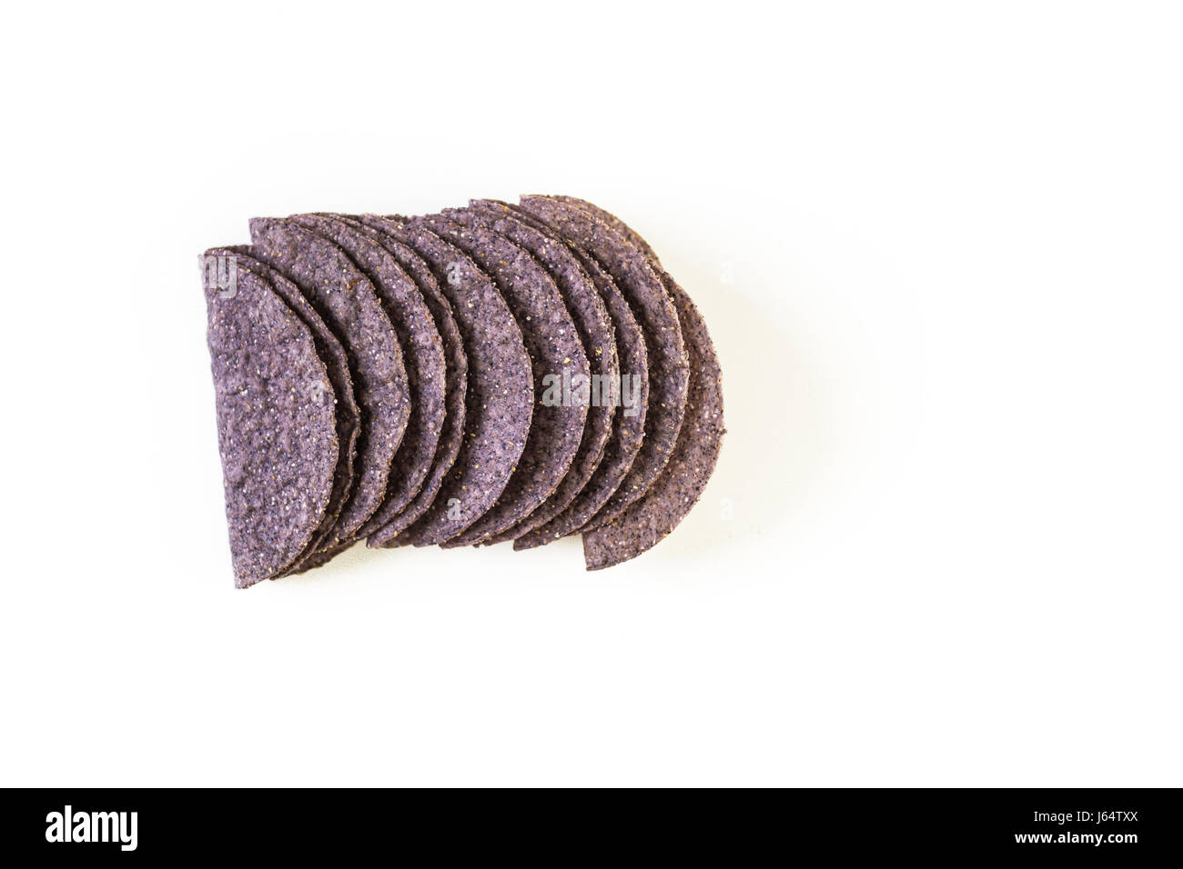 Blue corn taco shells on a white background Stock Photo - Alamy