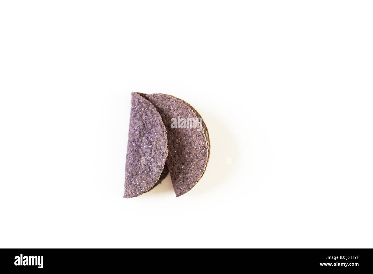 Blue corn taco shells on a white background Stock Photo - Alamy