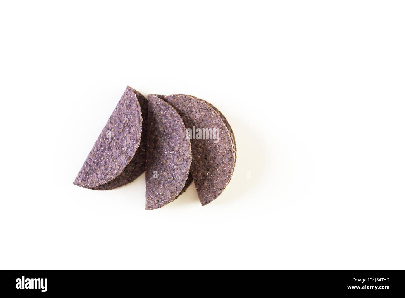 Blue corn taco shells on a white background Stock Photo - Alamy