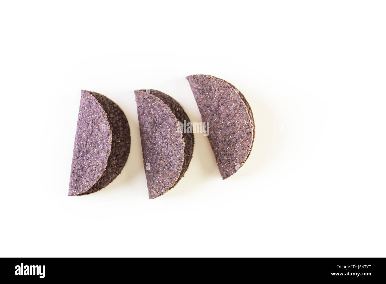 Blue corn taco shells on a white background Stock Photo - Alamy