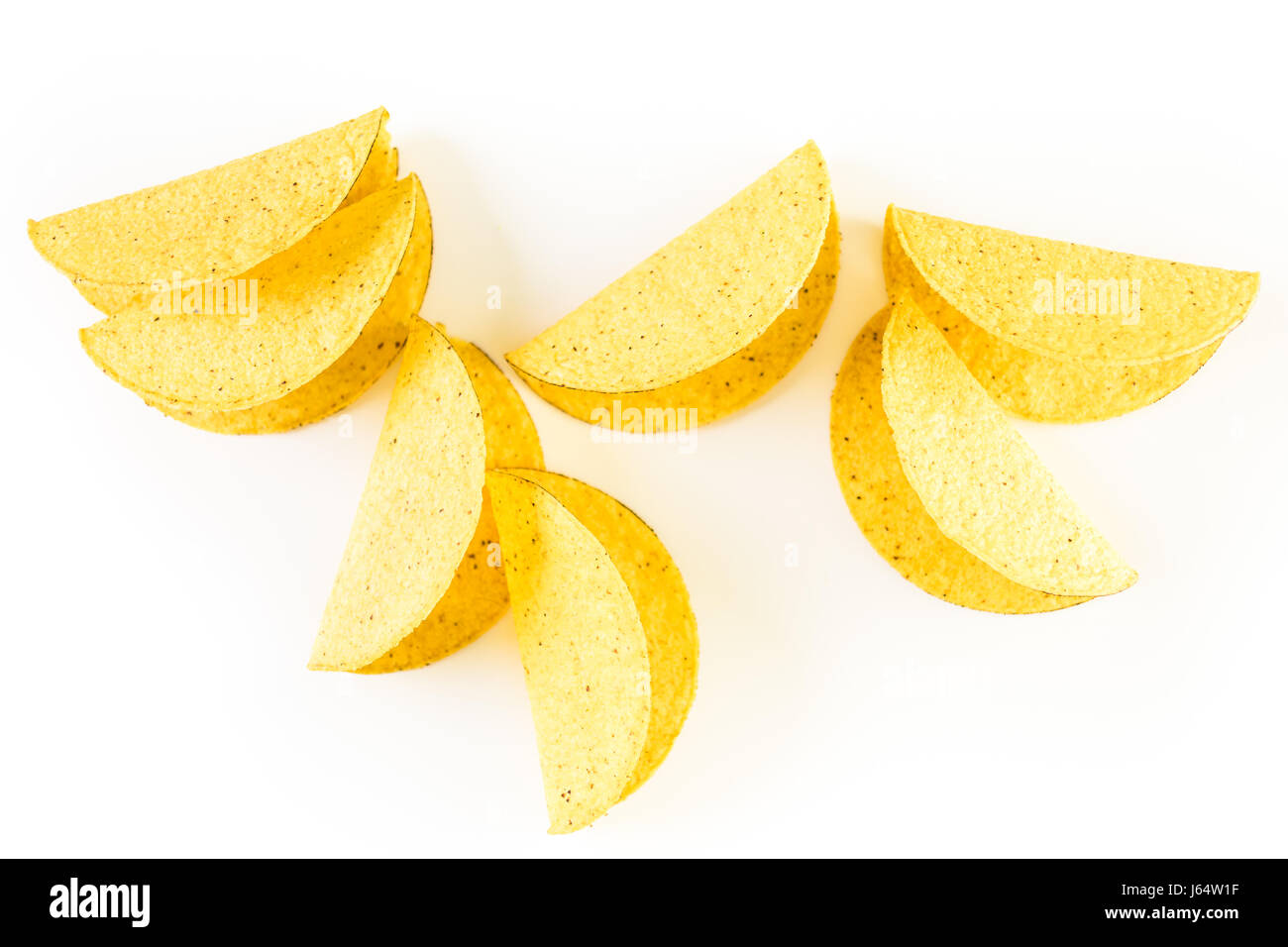 Yellow corn taco shells on a white background Stock Photo - Alamy