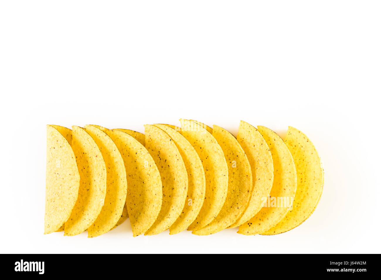 Yellow corn taco shells on a white background Stock Photo - Alamy