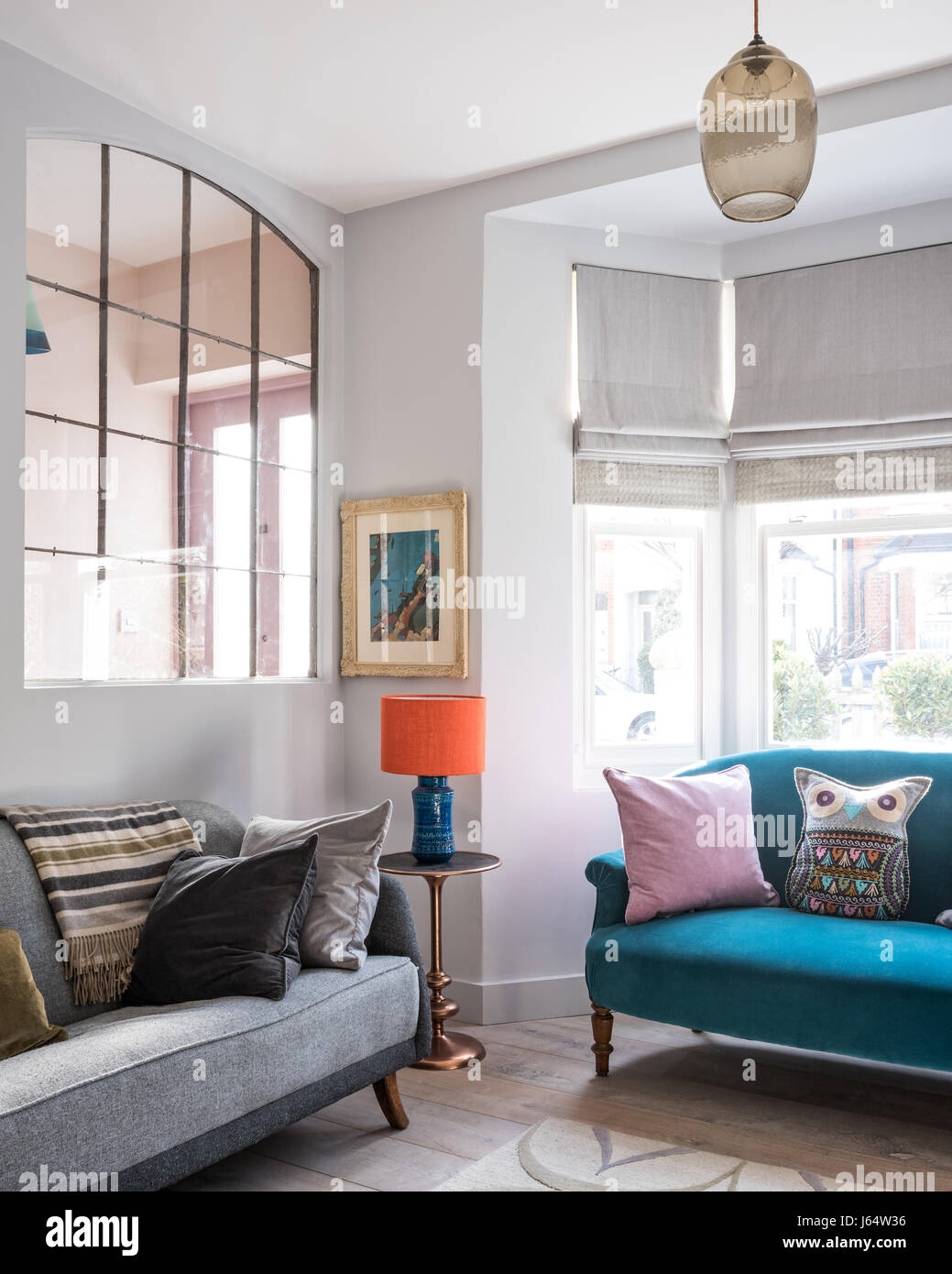 Large french metal salvaged windows in sitting room with grey vintage ...