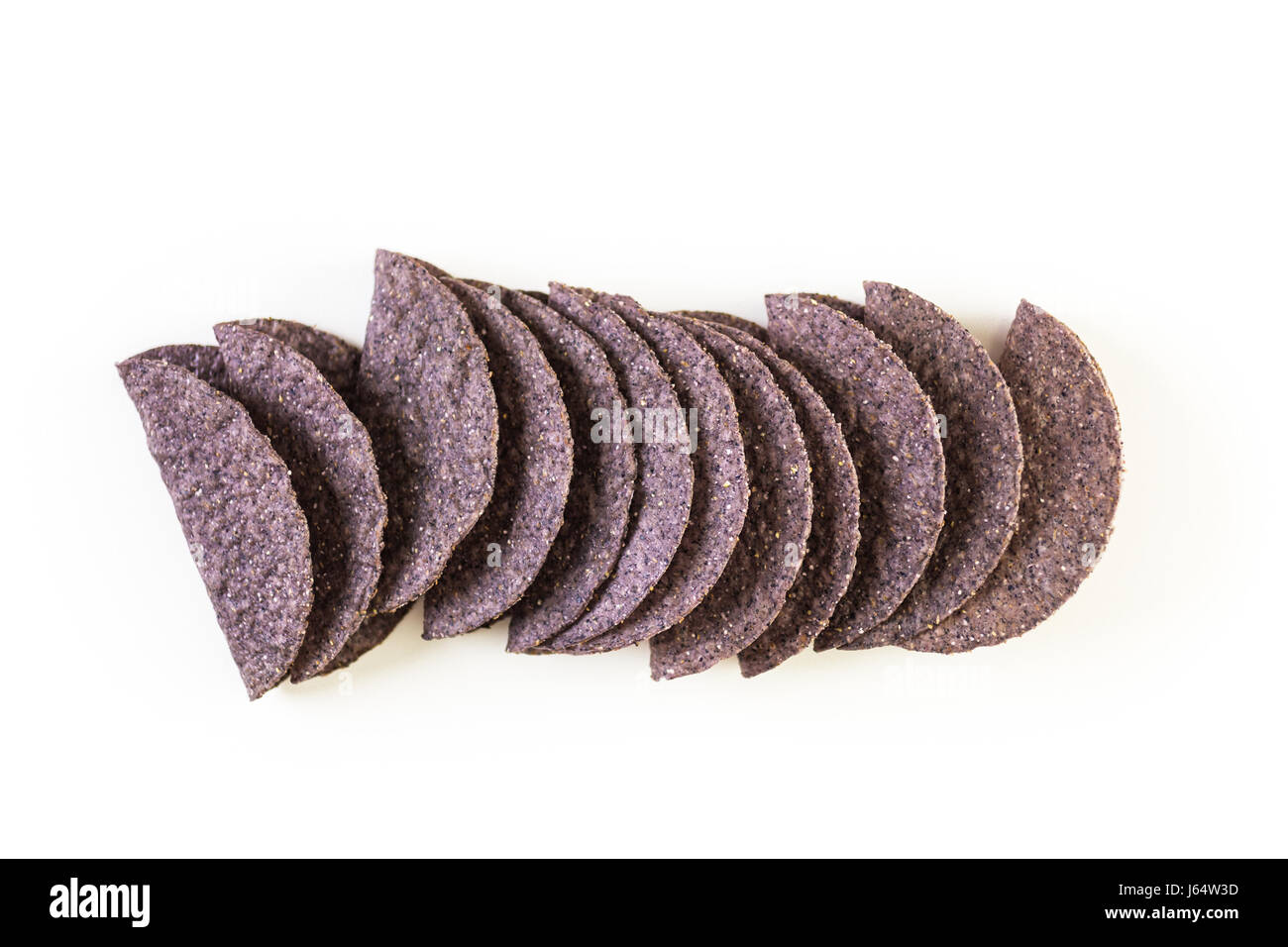 Blue corn taco shells on a white background Stock Photo - Alamy