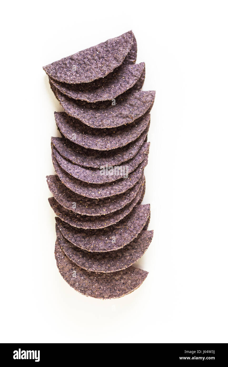 Blue corn taco shells on a white background Stock Photo - Alamy