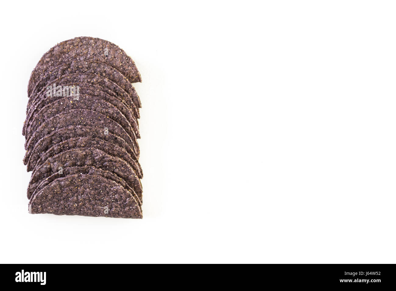 Blue corn taco shells on a white background Stock Photo - Alamy