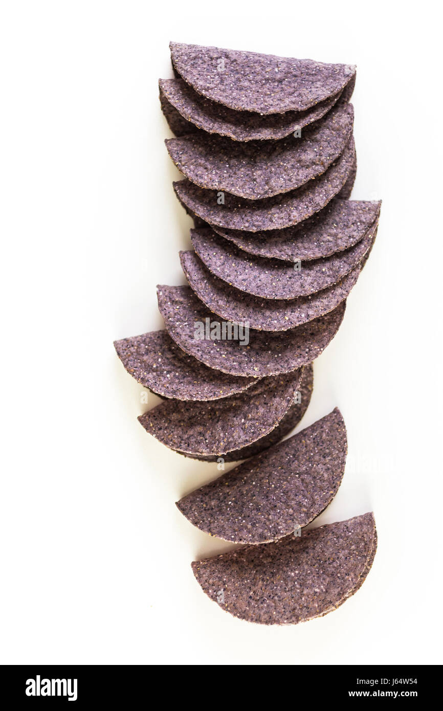 Blue corn taco shells on a white background Stock Photo - Alamy