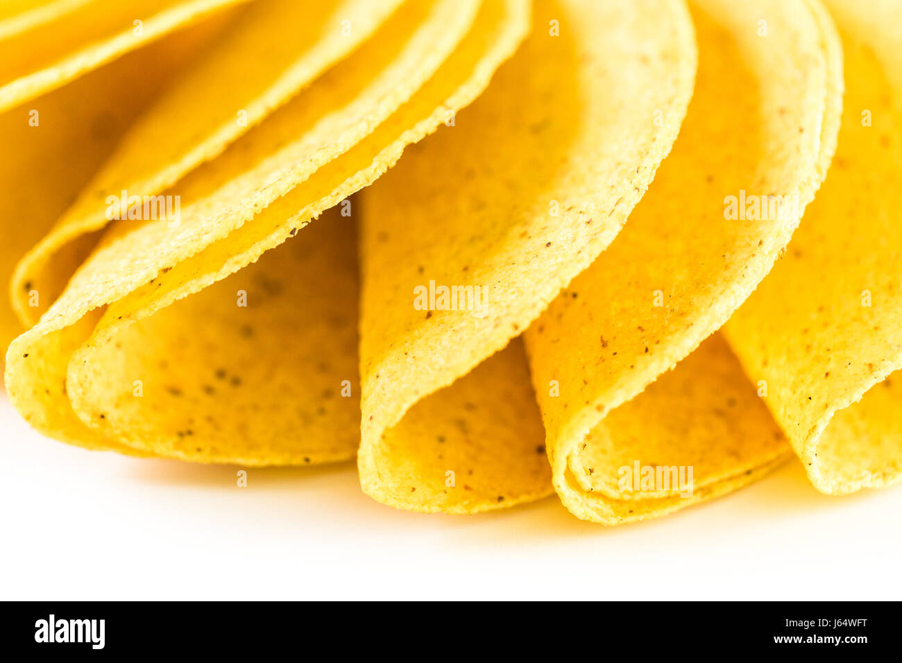 Yellow corn taco shells on a white background Stock Photo - Alamy