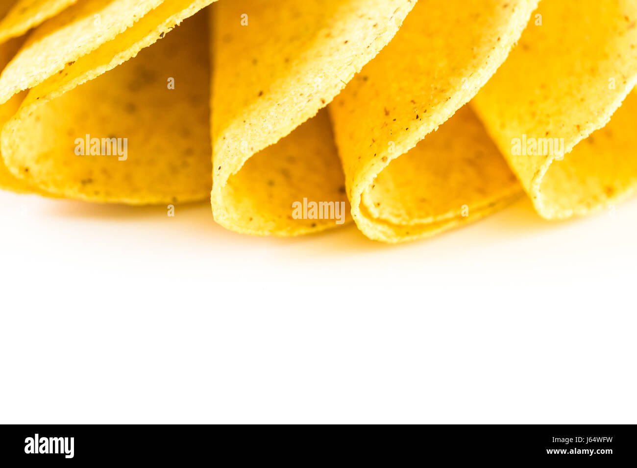 Yellow corn taco shells on a white background Stock Photo - Alamy