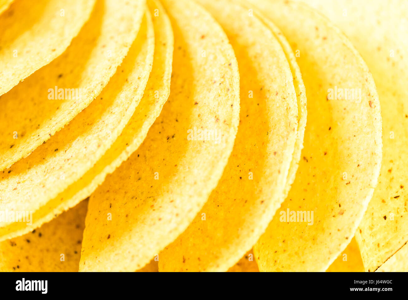 Yellow corn taco shells on a white background Stock Photo - Alamy