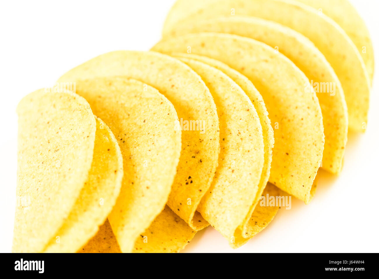 Yellow corn taco shells on a white background Stock Photo - Alamy