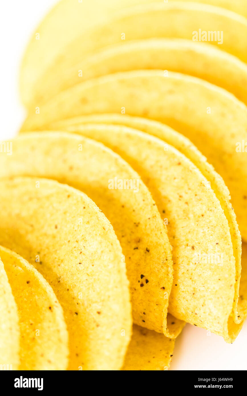 Yellow corn taco shells on a white background Stock Photo - Alamy