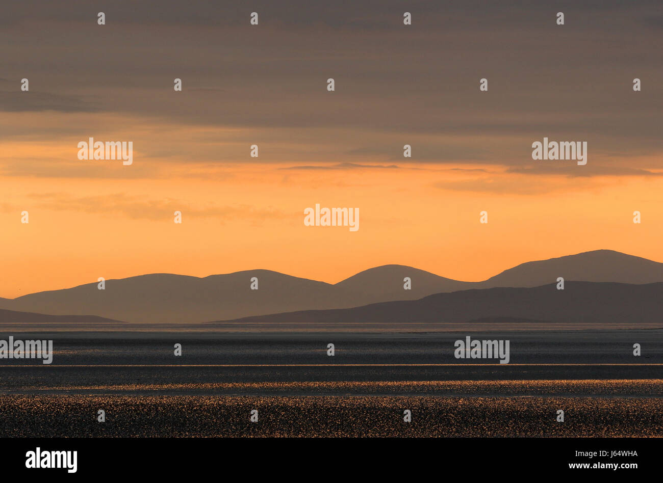 Sunset across Malacleit bay North Uist, Outer Hebrides, with the Isle ...