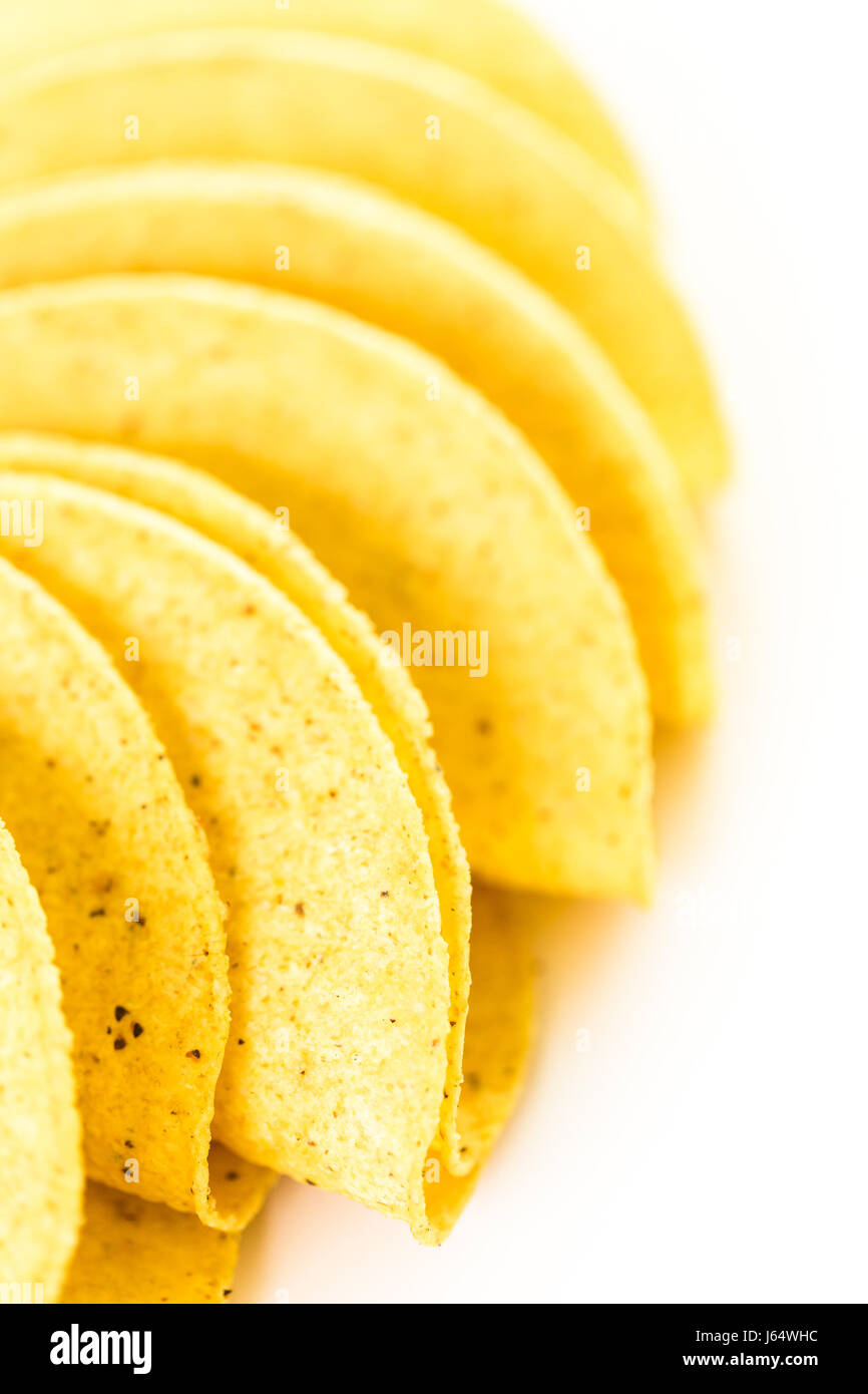 Yellow corn taco shells on a white background Stock Photo - Alamy