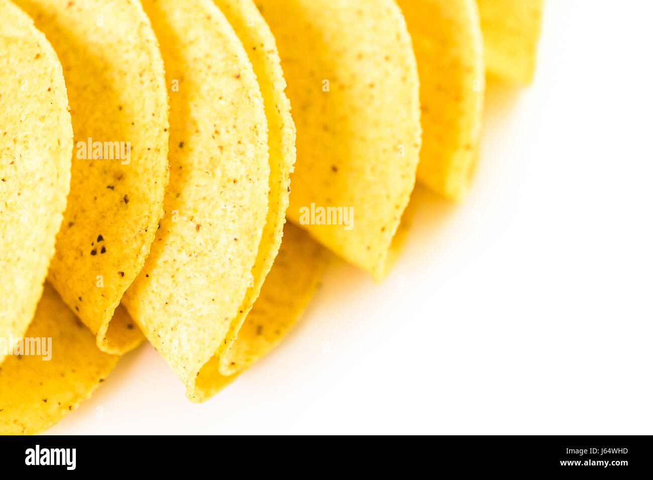 Yellow corn taco shells on a white background Stock Photo - Alamy