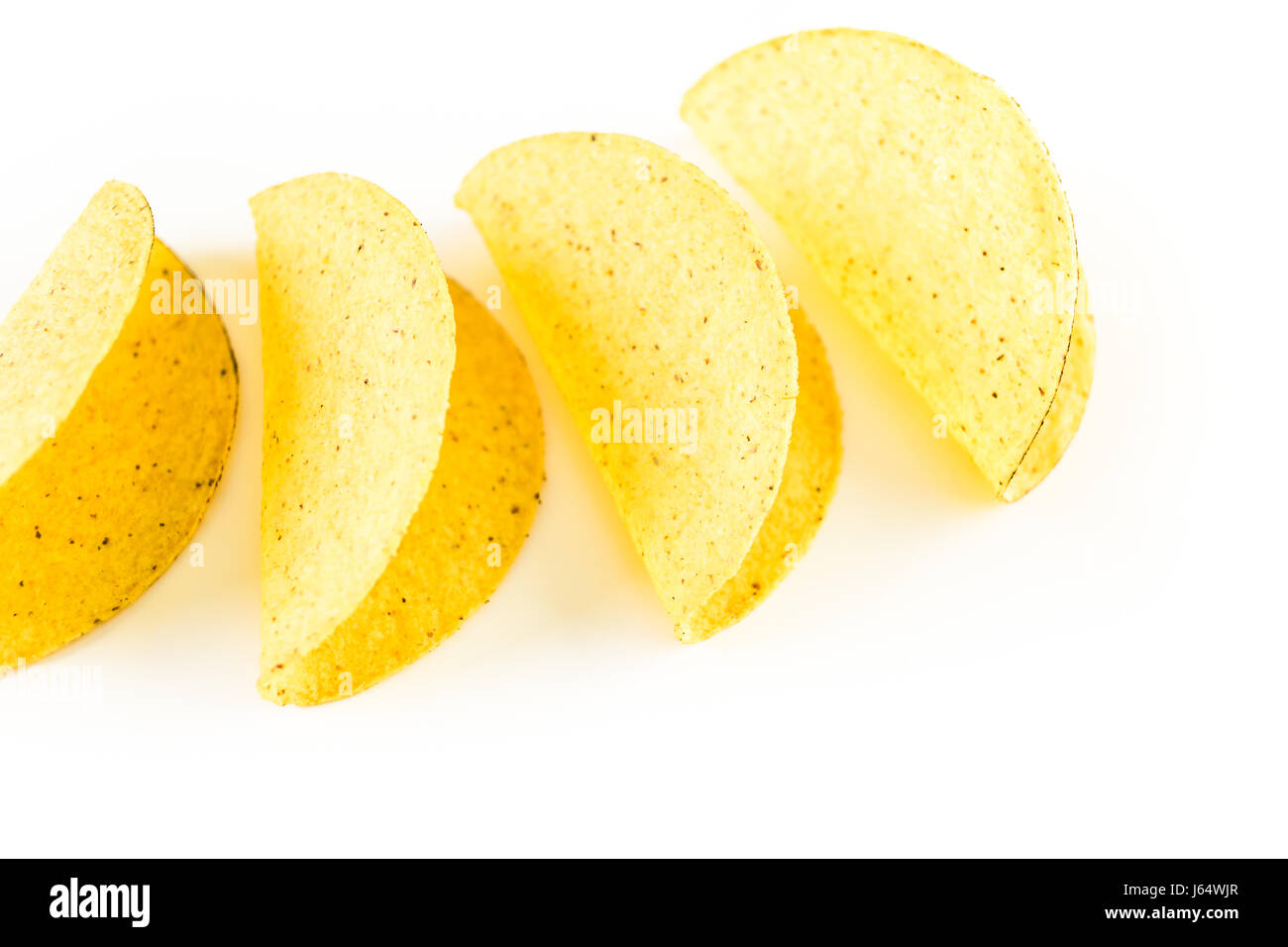 Yellow corn taco shells on a white background Stock Photo - Alamy