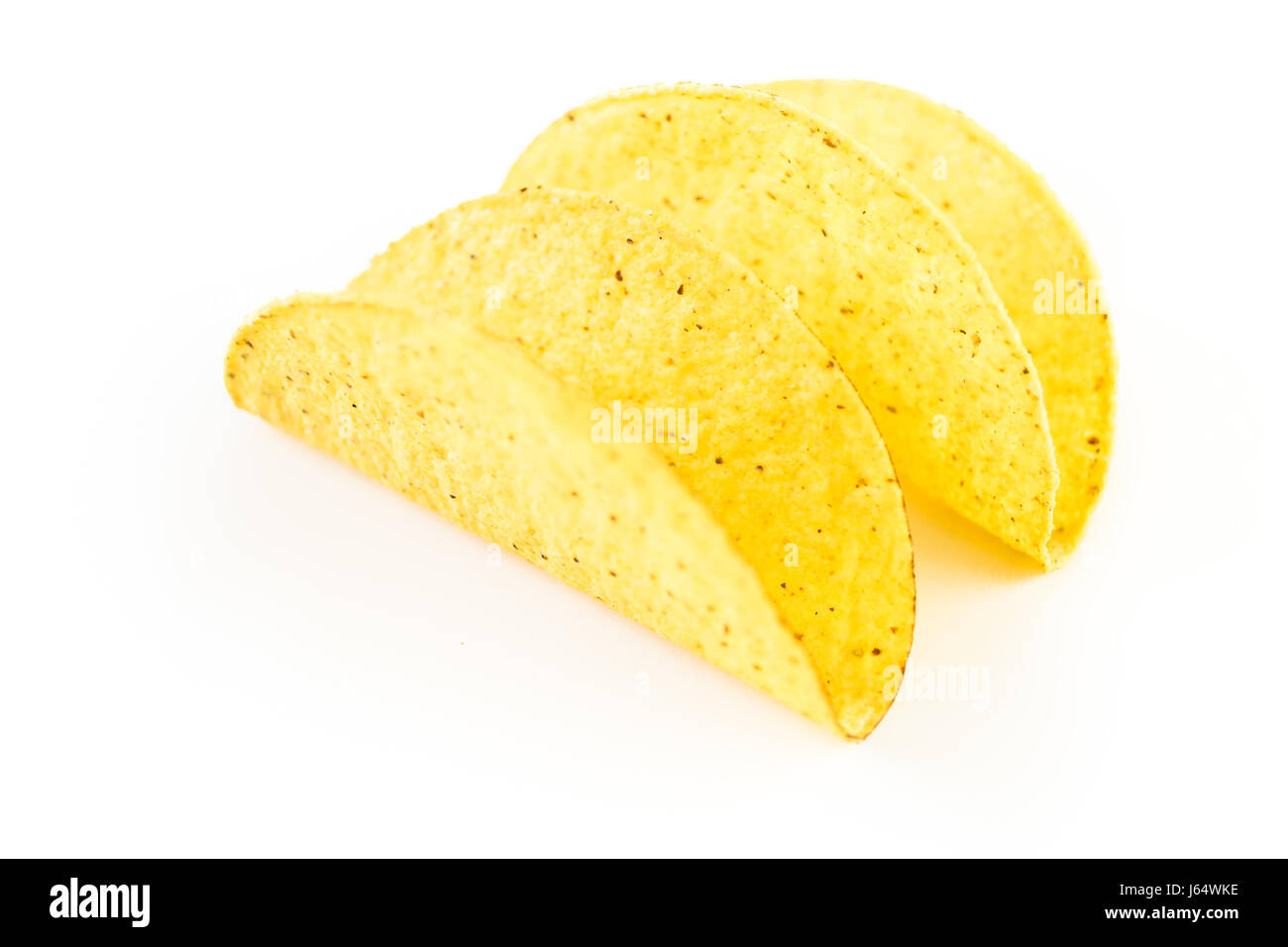 Yellow corn taco shells on a white background Stock Photo - Alamy