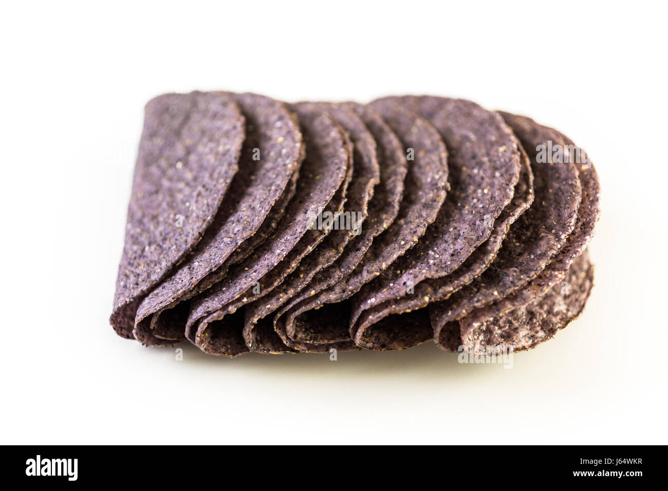 Blue corn taco shells on a white background Stock Photo - Alamy