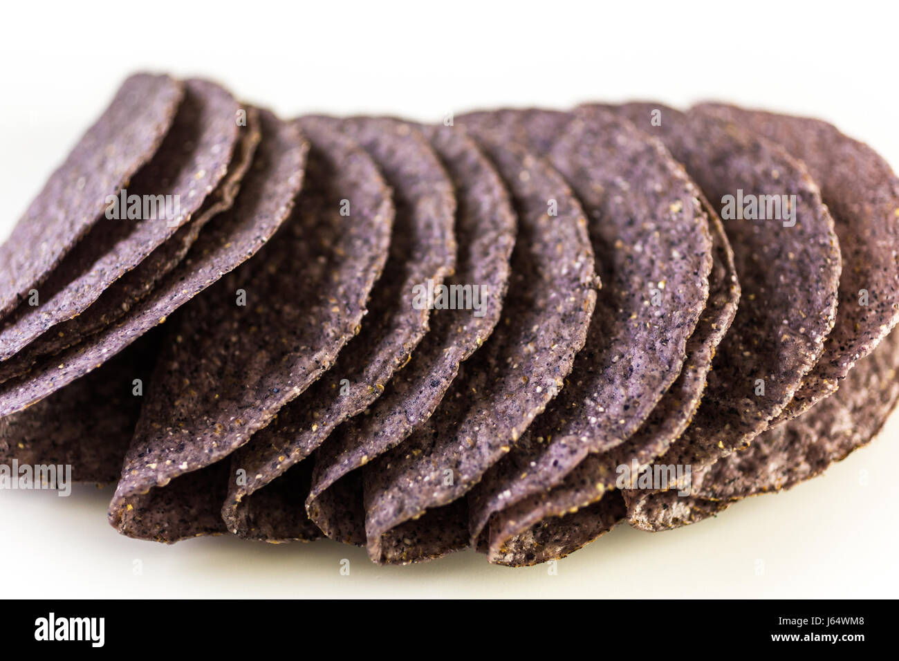 Blue corn taco shells on a white background Stock Photo - Alamy