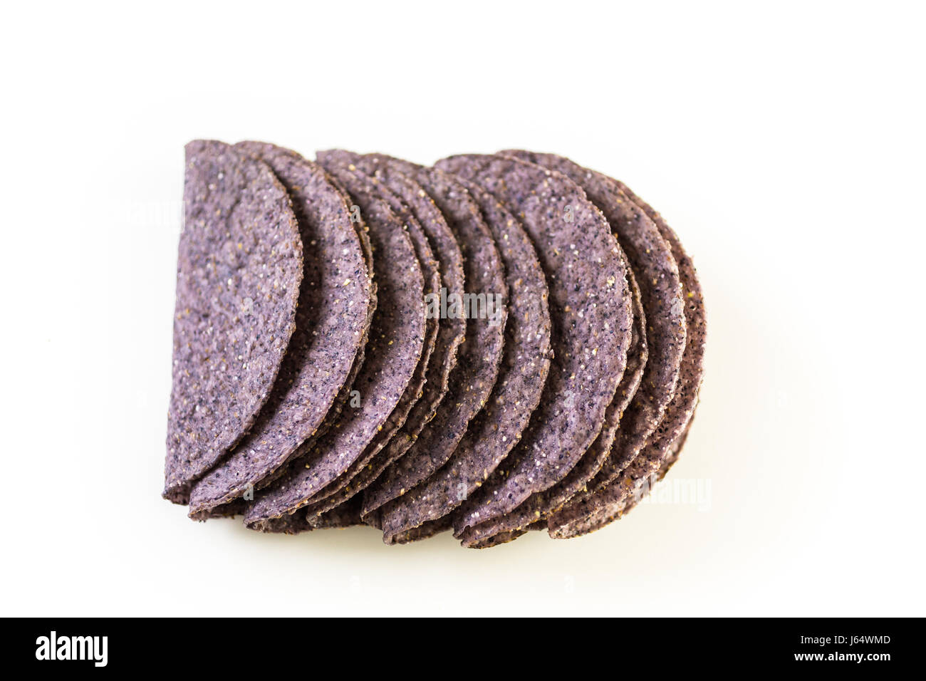 Blue corn taco shells on a white background Stock Photo - Alamy