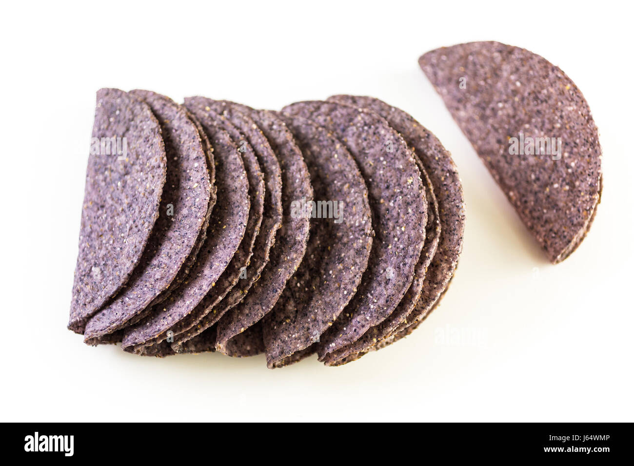 Blue corn taco shells on a white background Stock Photo - Alamy