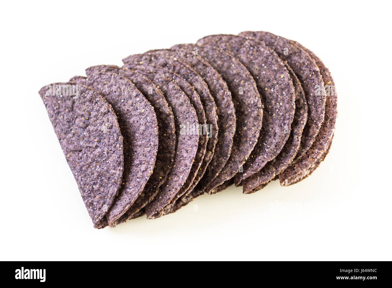 Blue corn taco shells on a white background Stock Photo - Alamy