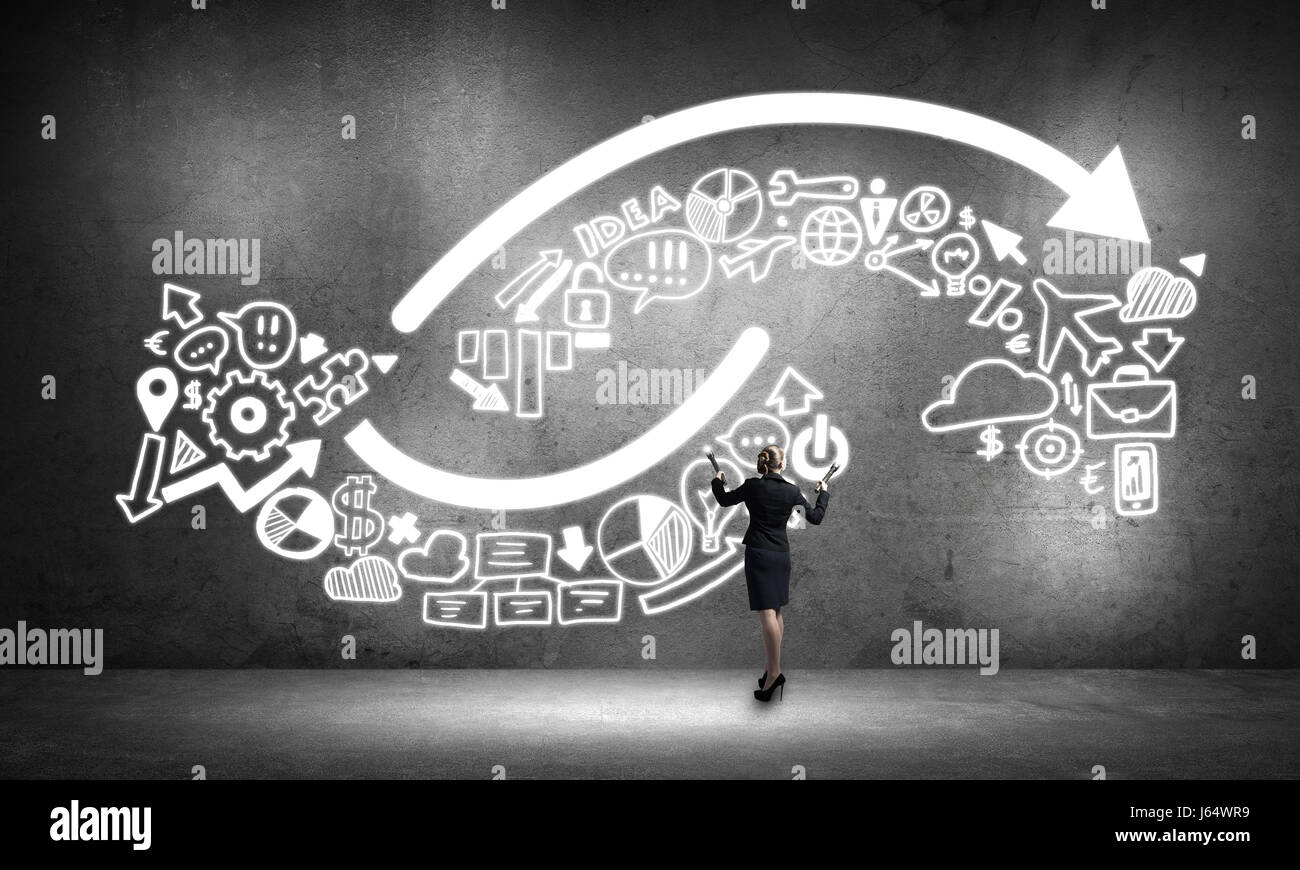 Woman throwing light on her ideas Stock Photo - Alamy