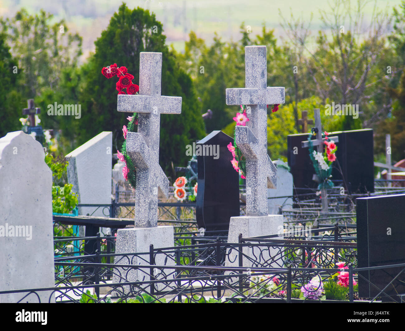 Two crosses and graves in the old cemetery Stock Photo - Alamy