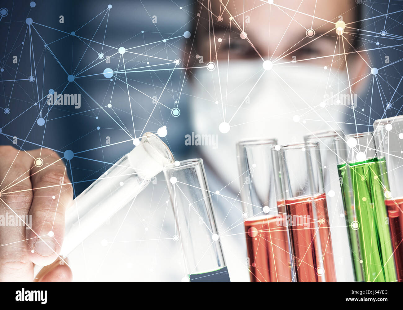 Young scientist mixing reagents in glass flask in clinical laboratory ...
