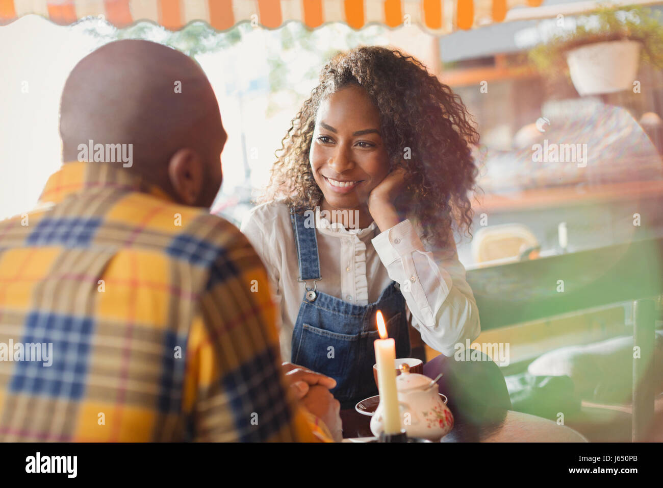 Young couple talking in cafe Stock Photo - Alamy
