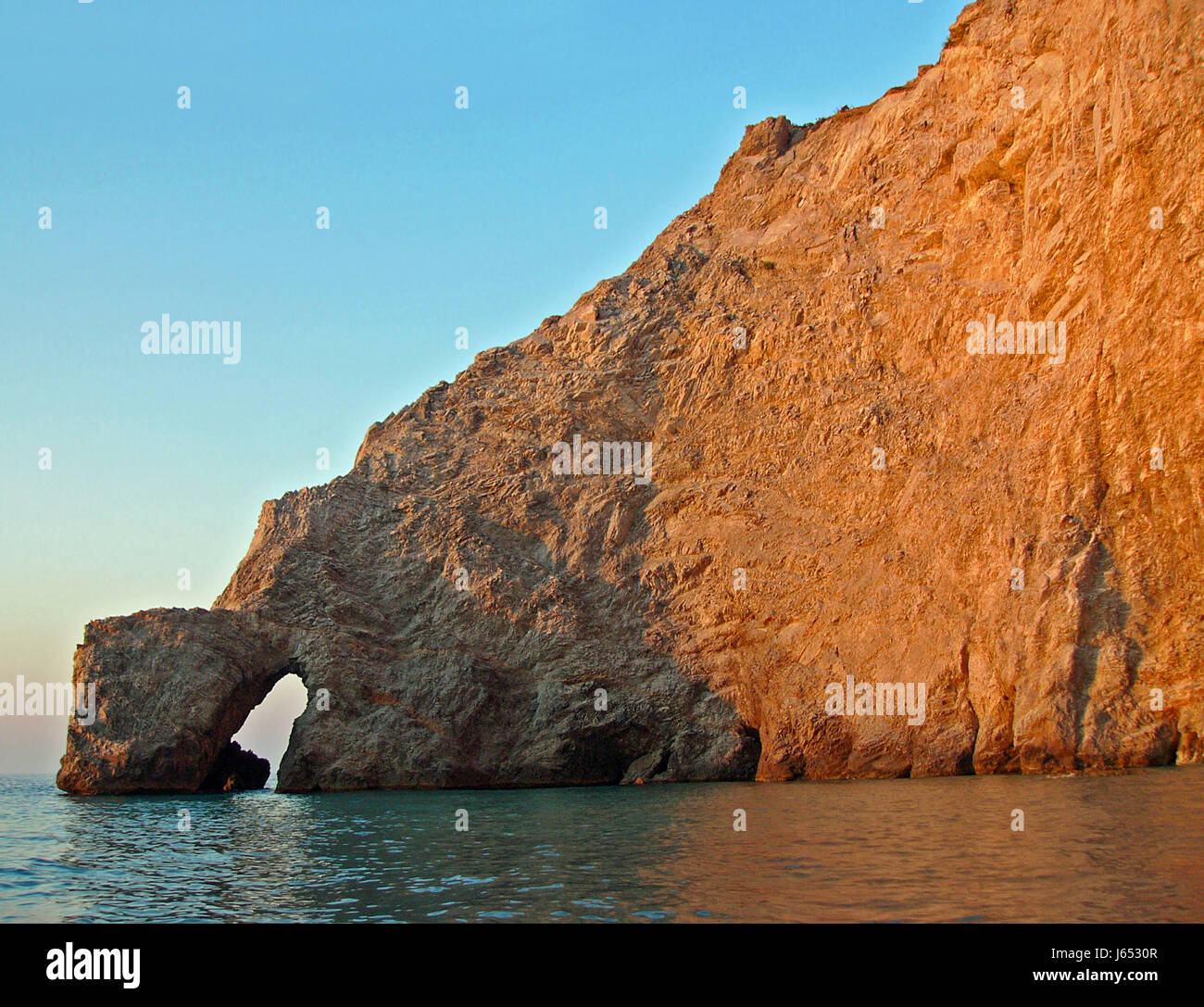 sunset glow steep coast limestone sunset greece water mediterranean ...