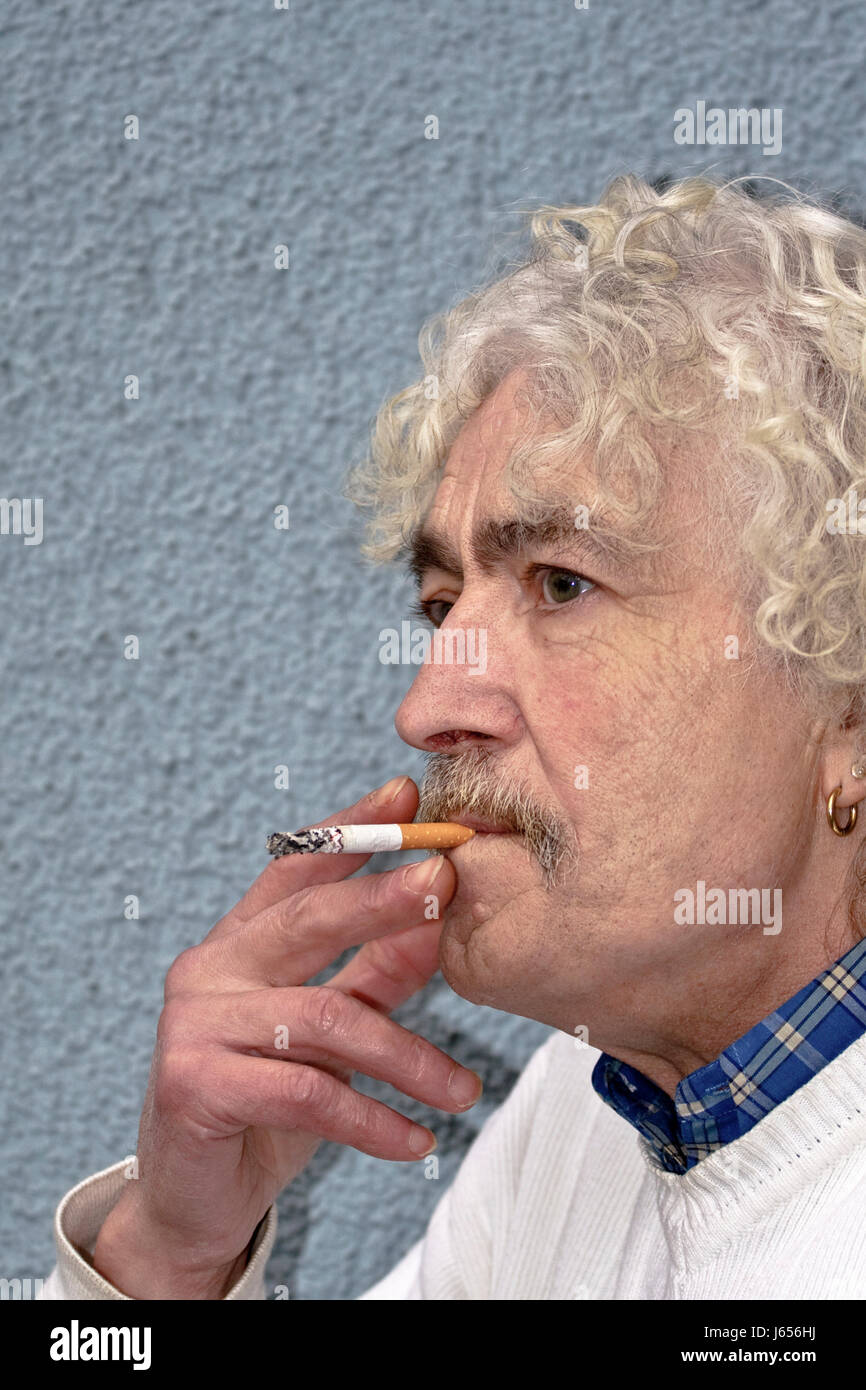 Old age pensioner smoking cigarette hi-res stock photography and images ...