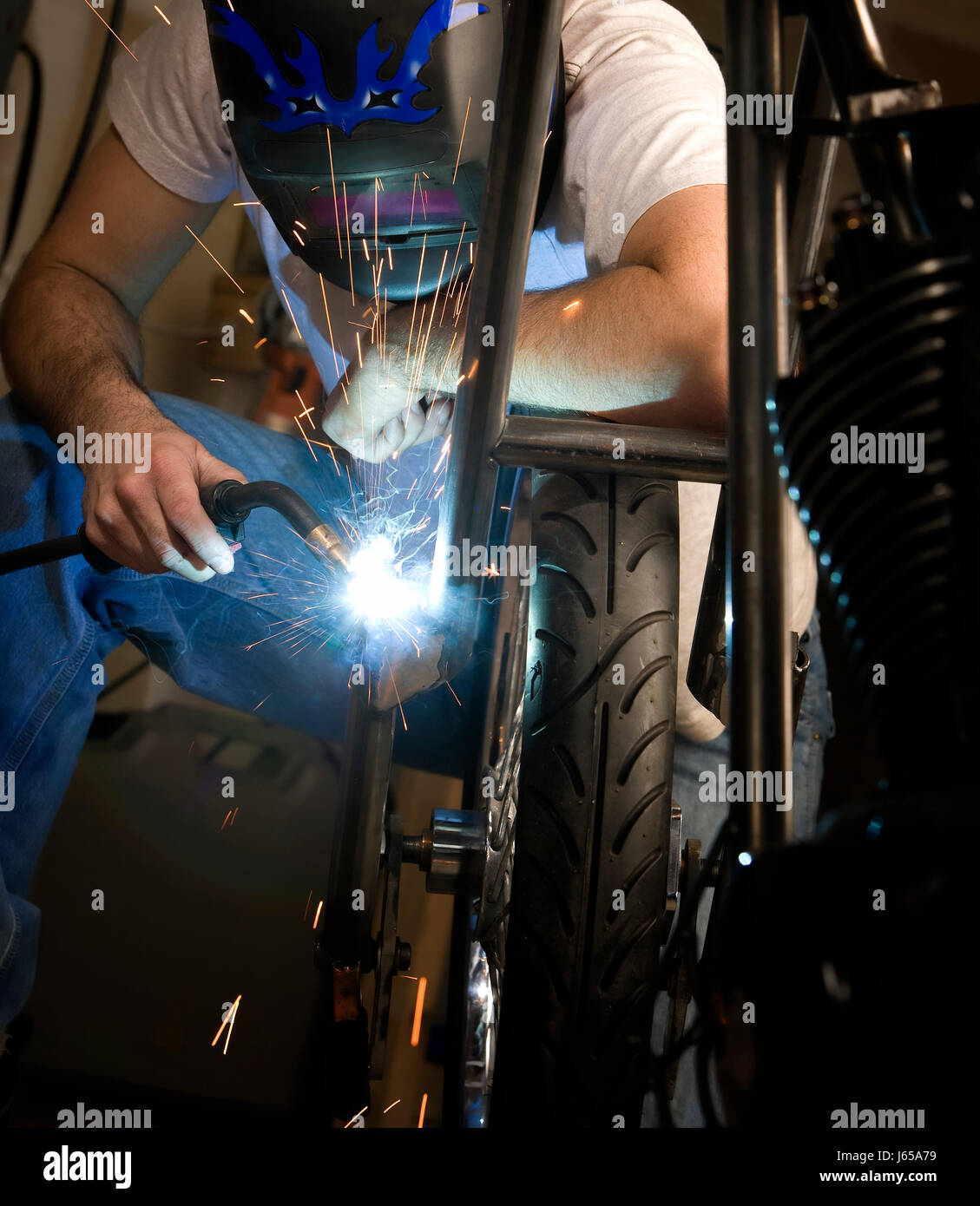 male masculine mechanic spark welding man welder hand build wheel male ...