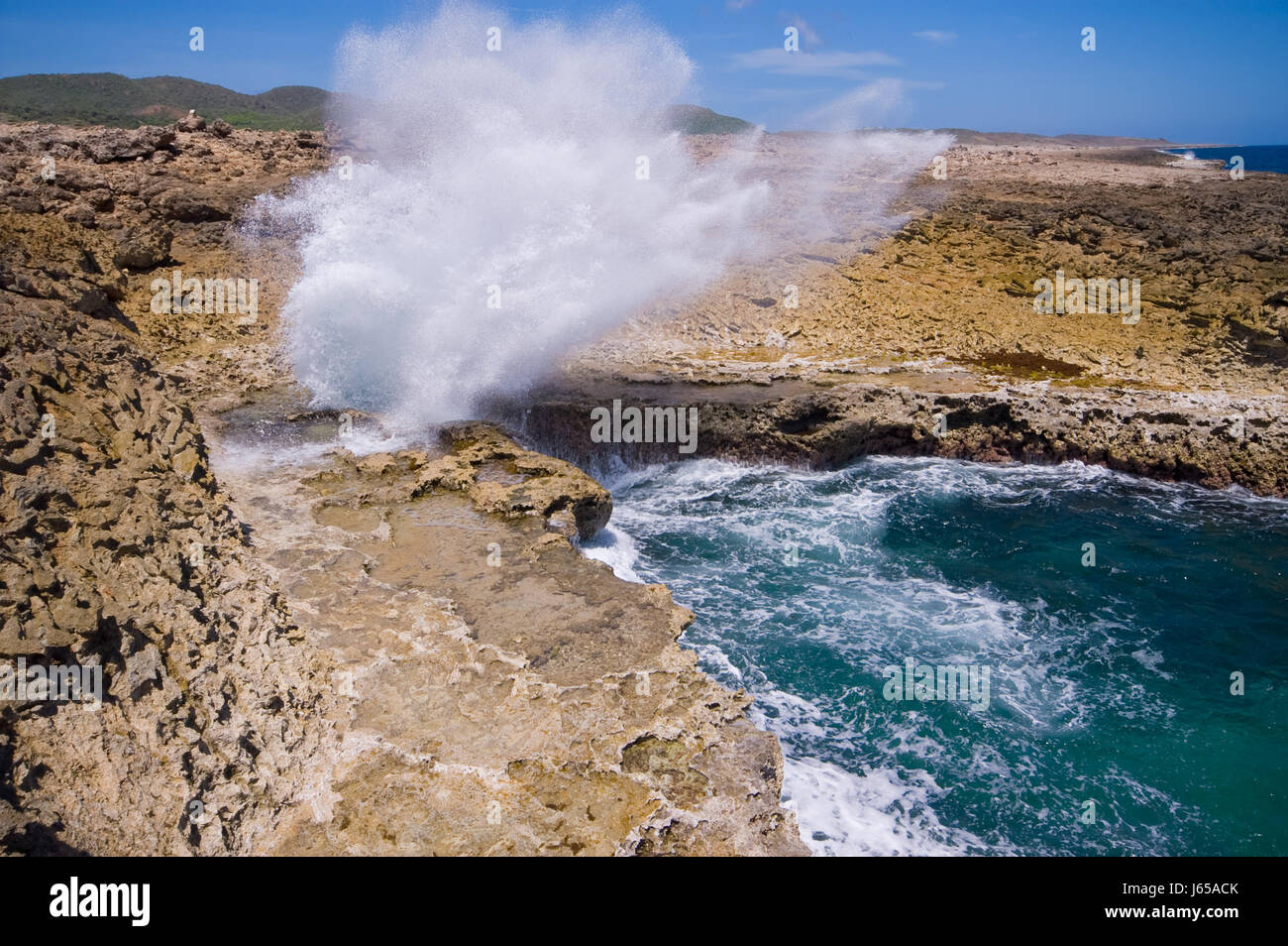 coast pistol arm weapon inlet salt water sea ocean water shore blue ...