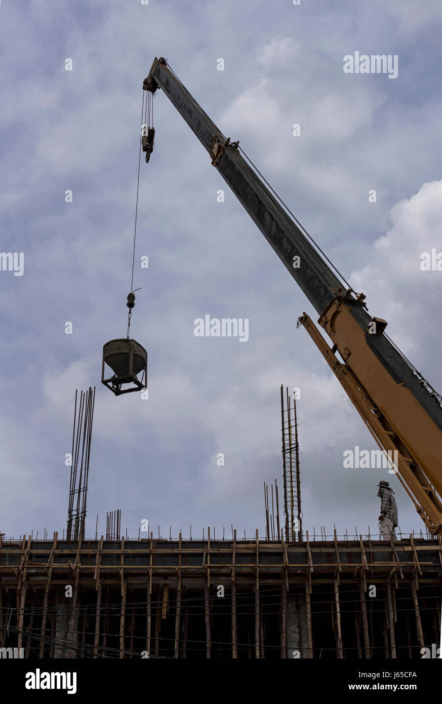 Lifting concrete bucket up by crane hi-res stock photography and images ...
