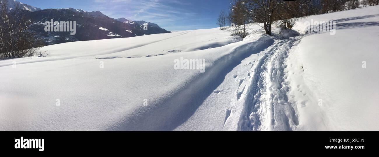 path in the snow crossing mountain in winter Stock Photo - Alamy