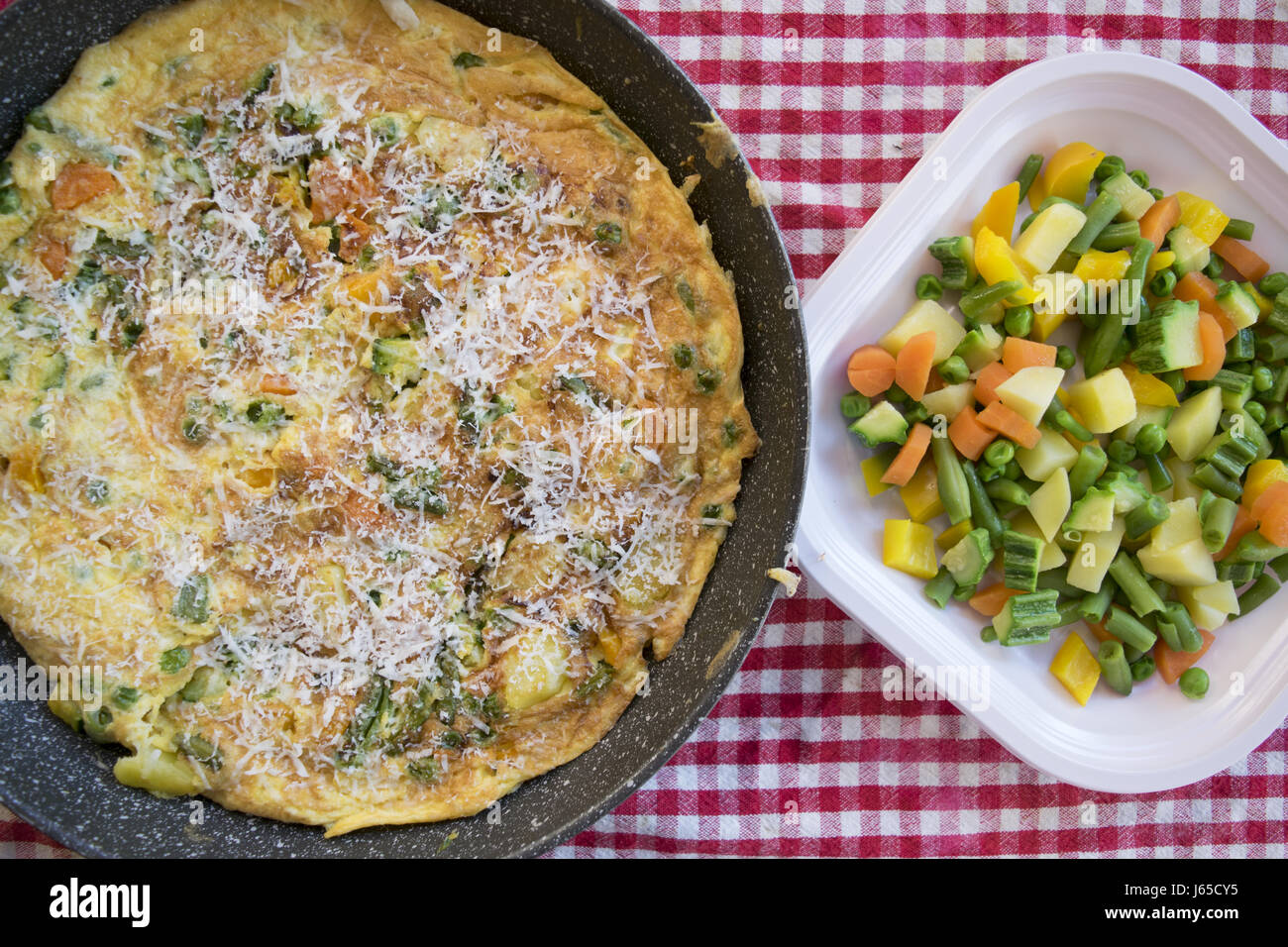 omelette with steamed vegetables in cubes and parmesan cheese Stock ...
