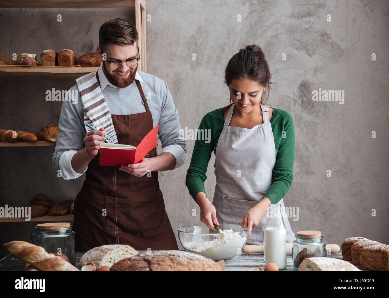 Young smiling woman under sensitive guidance of her man listening ...